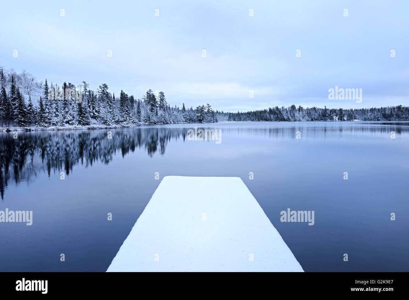 Snow on dock in Lyons Lake in early winter, Whiteshell Provincial Park ...