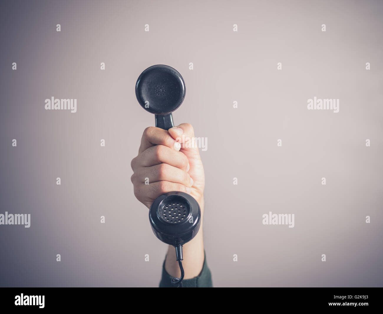 Hand holding receiver of telephone hi-res stock photography and images ...