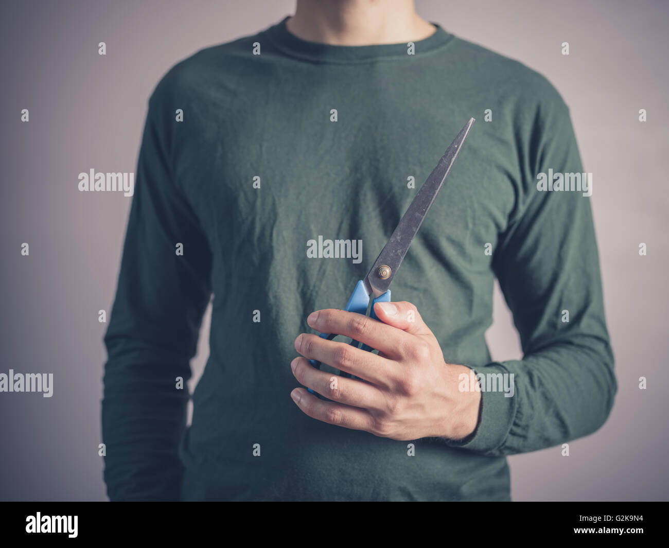 Hand holding pair scissors hi-res stock photography and images - Alamy