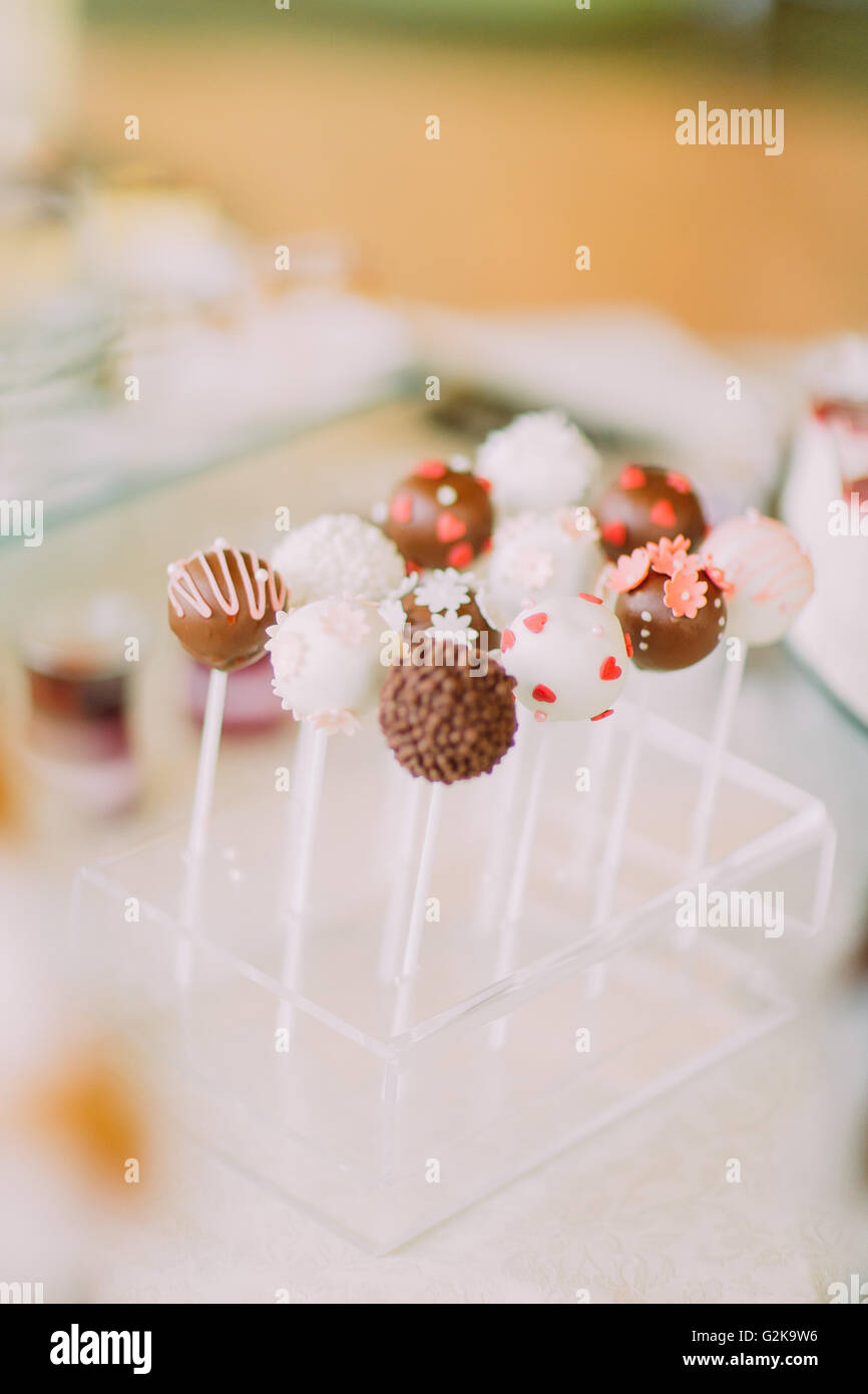 Set of sweet decorated chocolate candies on sticks. Close-up Stock ...