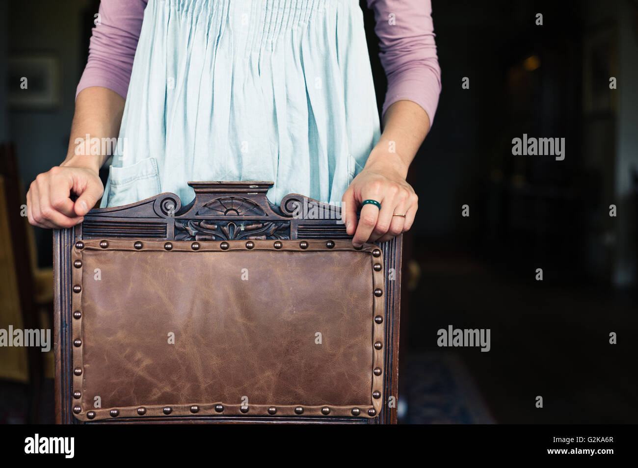 Standing behind chair hi-res stock photography and images - Alamy