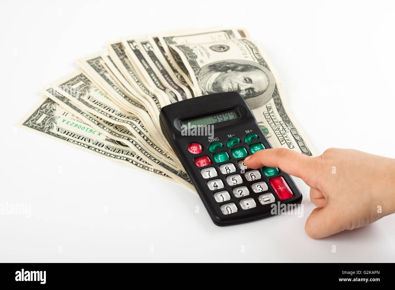 a child calculating expancess on a calculator that stands on a couple ...