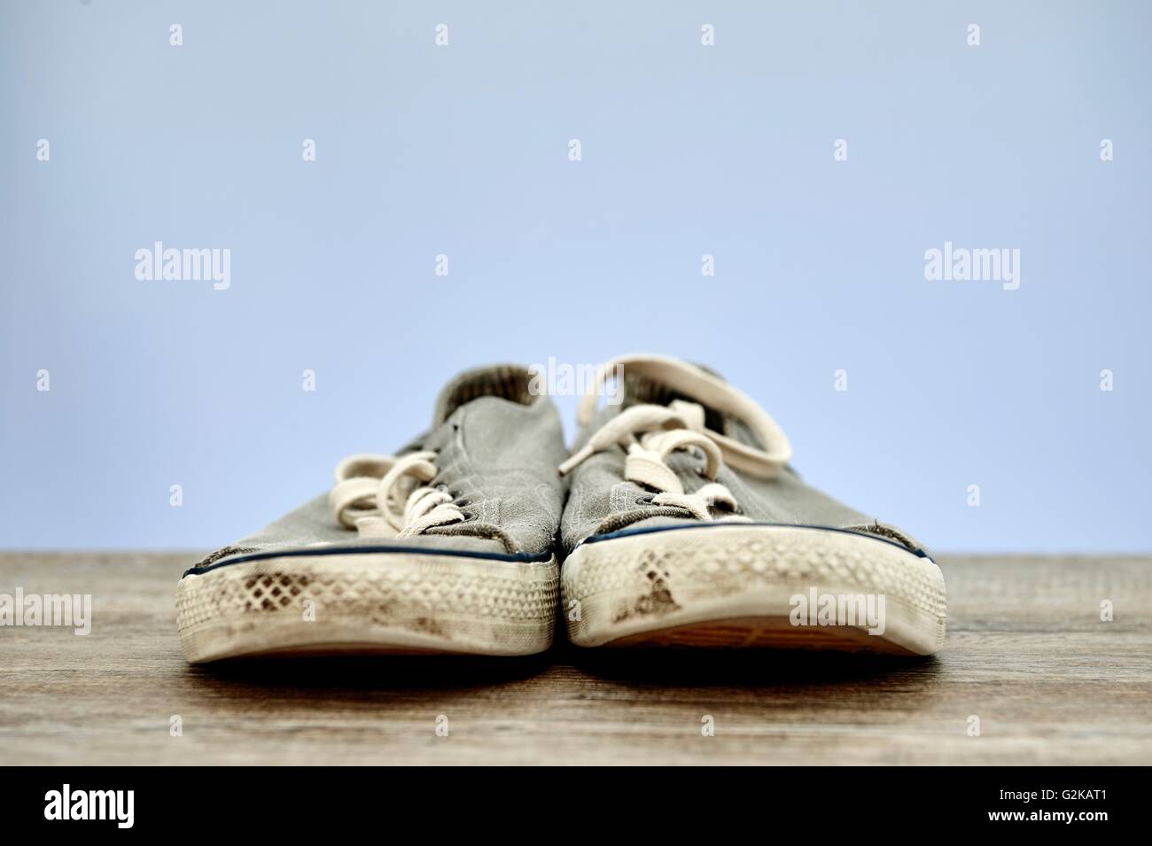 A studio photo of a pair of old sneakers Stock Photo - Alamy