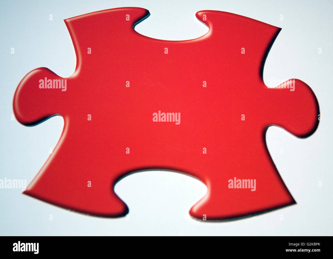 Red Puzzle Piece Close-up Stock Photo - Alamy