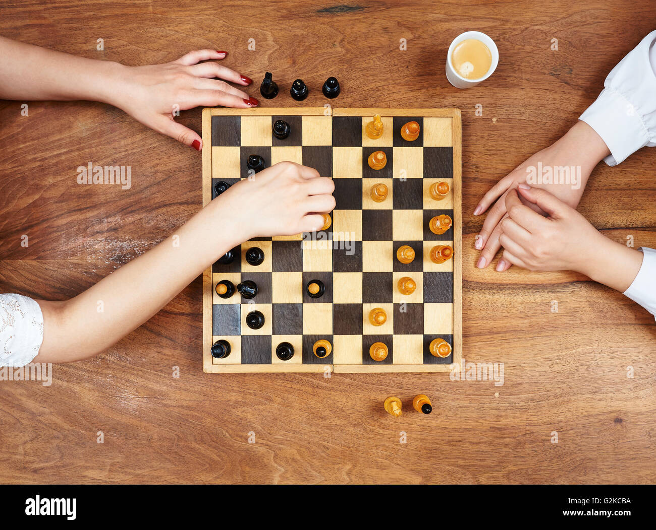 Hands playing chess Stock Photo - Alamy