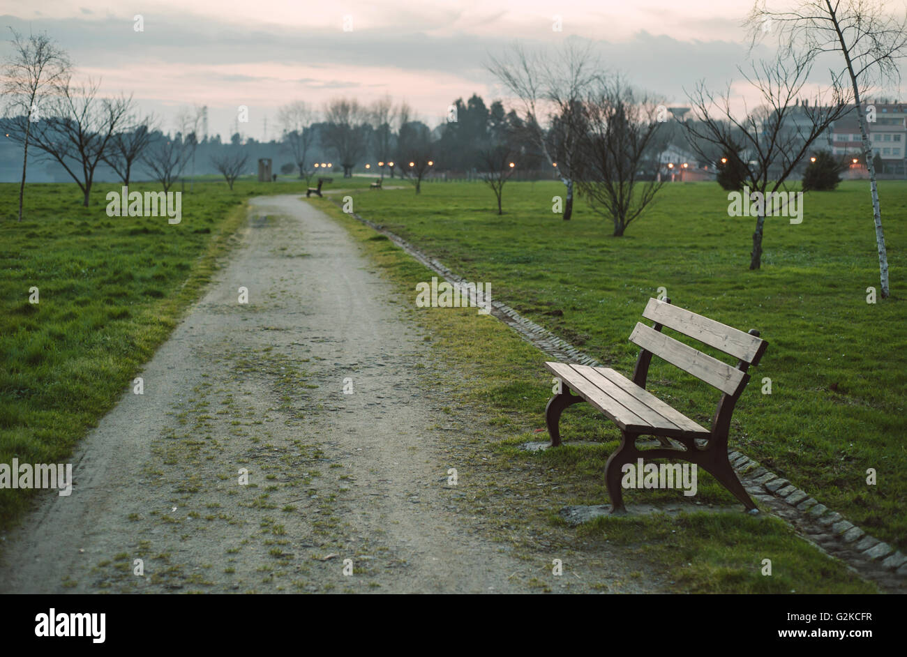 Spain, Galicia, Naron, Dirt track with a bench in the twilight Stock ...