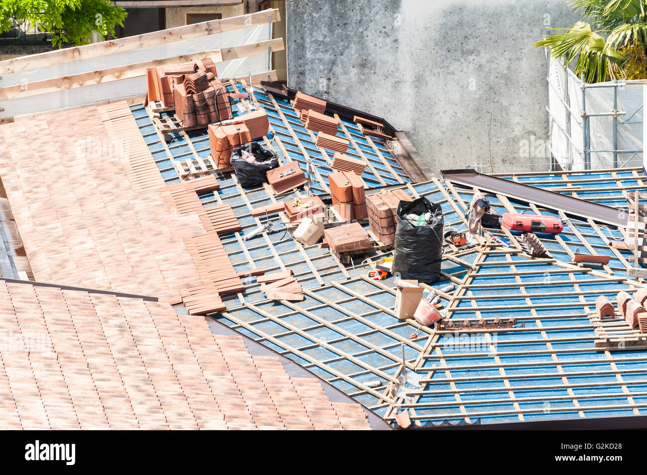 Construction site. Roof renovation. Pallets of shingles Stock Photo - Alamy