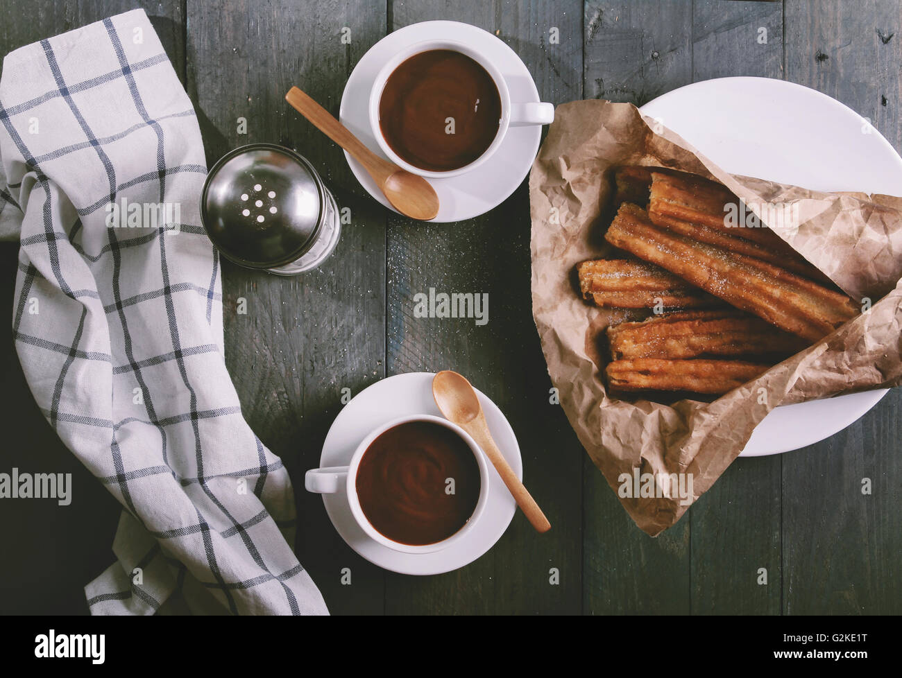 Churros with cups of hot chocolate Stock Photo - Alamy