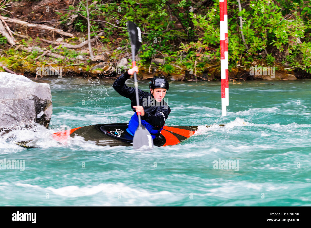 A slalom kayaker navigates the gates at the Canoe Meadows course on the ...