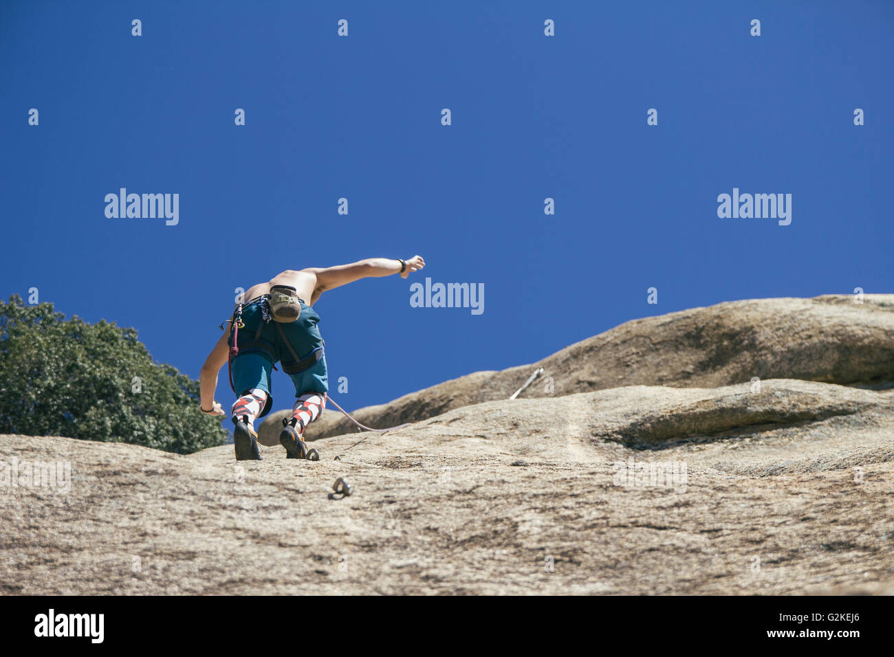 Man climbing without hands Stock Photo - Alamy