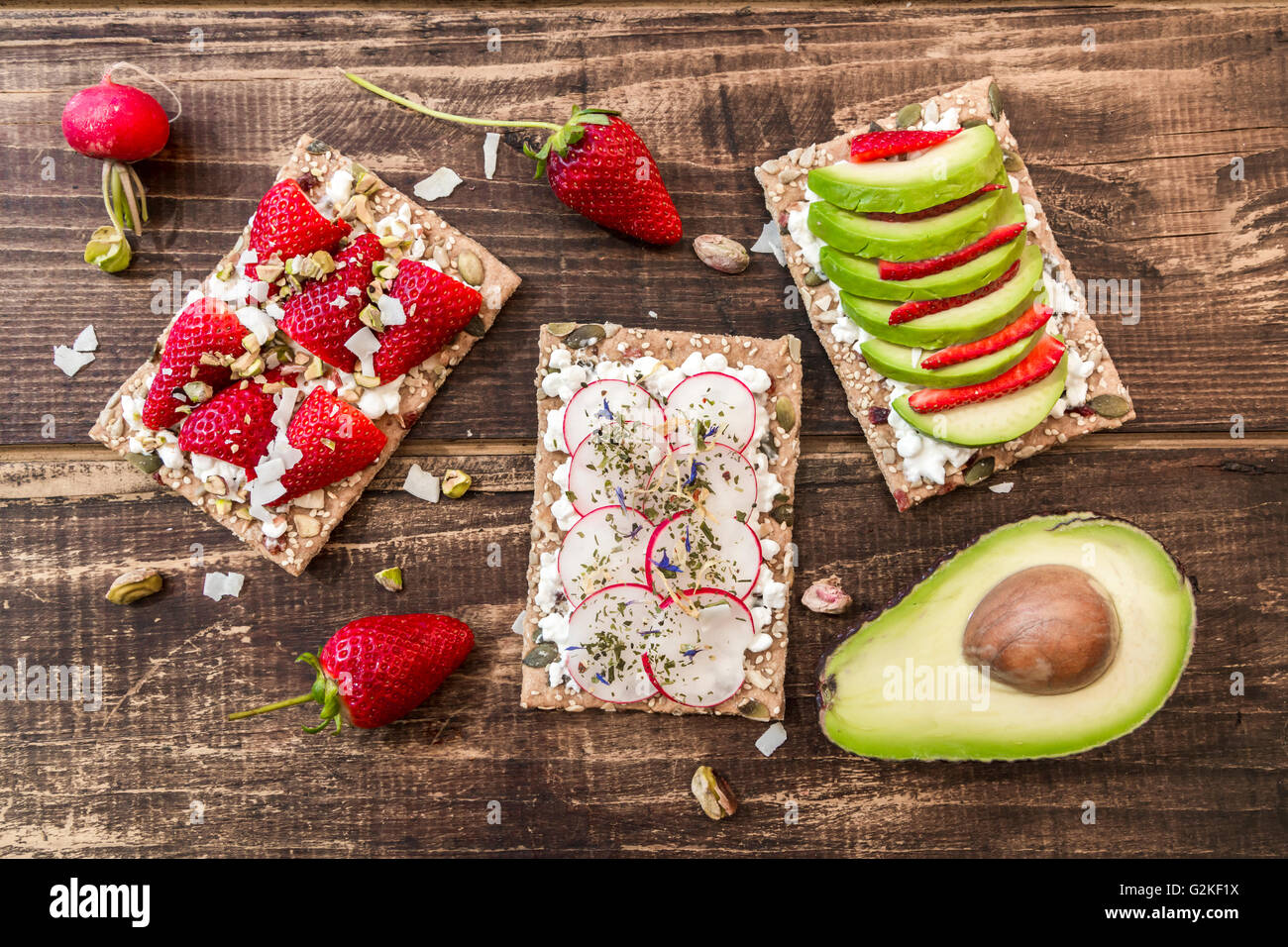 Three crispbreads with different toppings Stock Photo - Alamy
