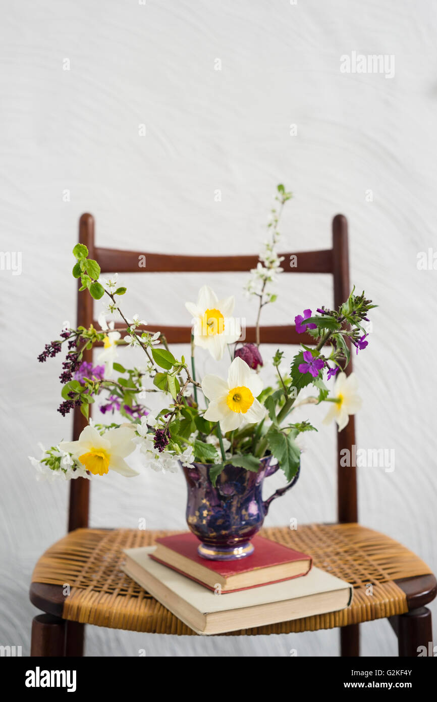 Spring bunch of flowers on chair Stock Photo - Alamy
