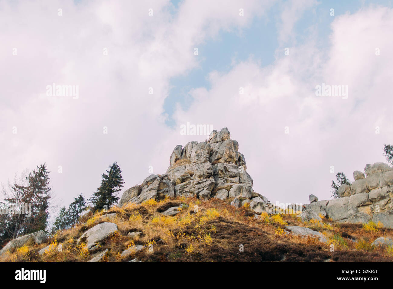 Majestic looking rocky mountain top with cloudy sky on background Stock ...
