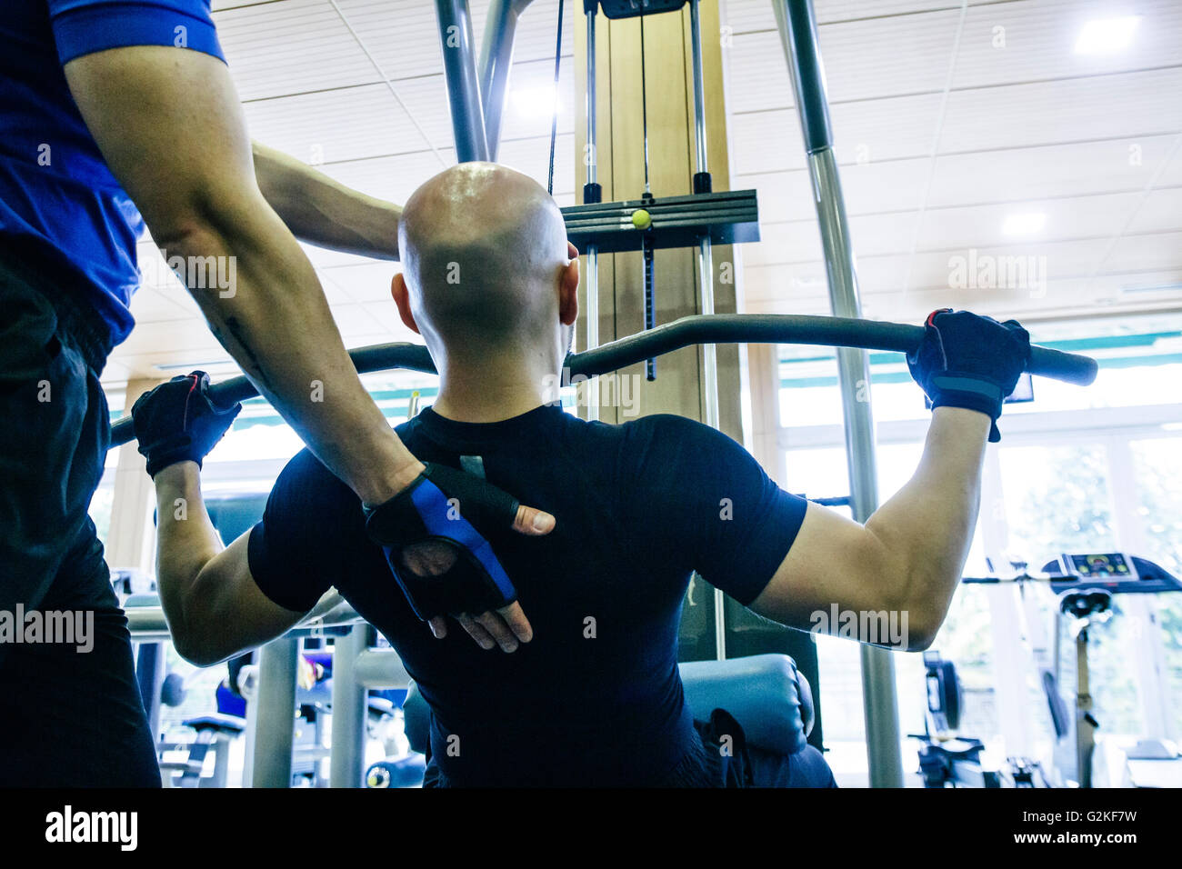 Man doing exercise assisted hi-res stock photography and images - Alamy
