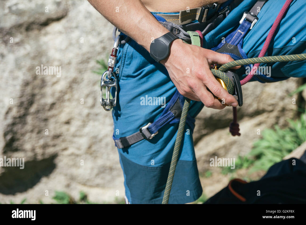 Hand of a climber securing during climbing Stock Photo - Alamy