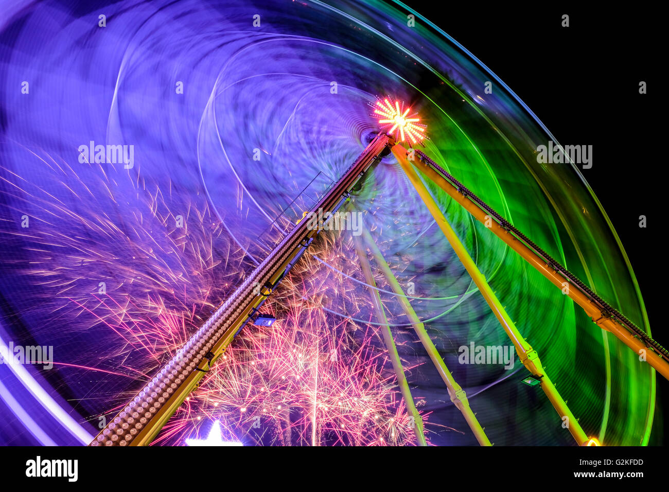 Big wheel and fireworks at night Stock Photo - Alamy