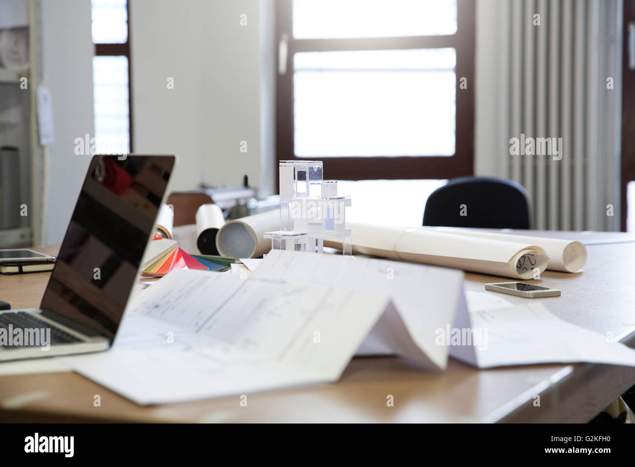 Desktop with laptop, construction plans and architectural model Stock ...