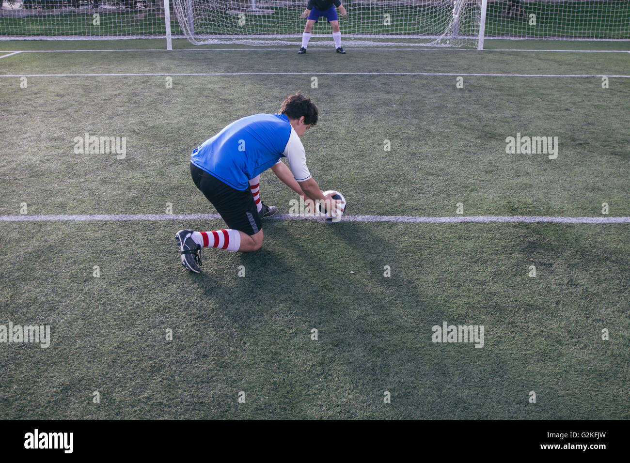 Football player placing the ball on the line in front of the goal Stock ...