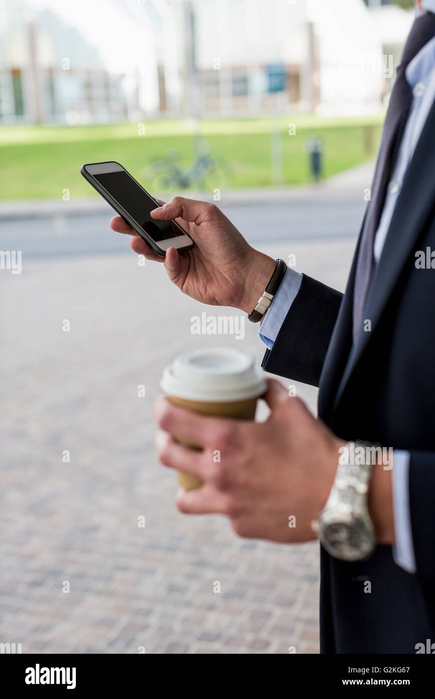 Businessman using cell phone outdoors Stock Photo - Alamy Businessman using cell phone outdoors Stock Photo - Alamy