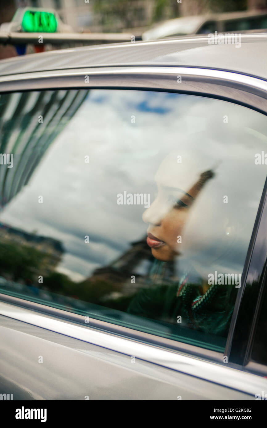 France, Paris, young woman looking through car window Stock Photo - Alamy