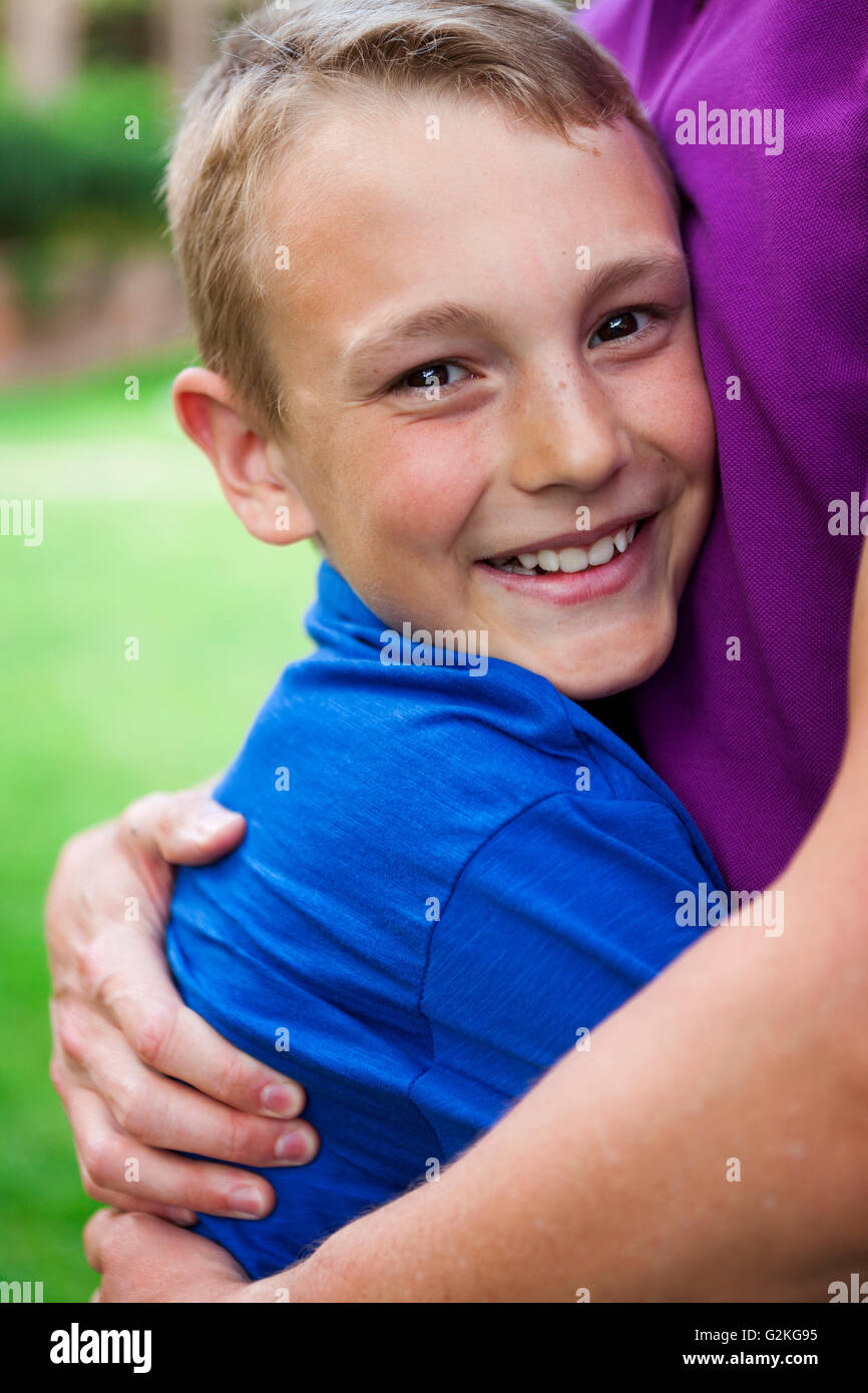 Portrait of happy boy hugging his father Stock Photo - Alamy