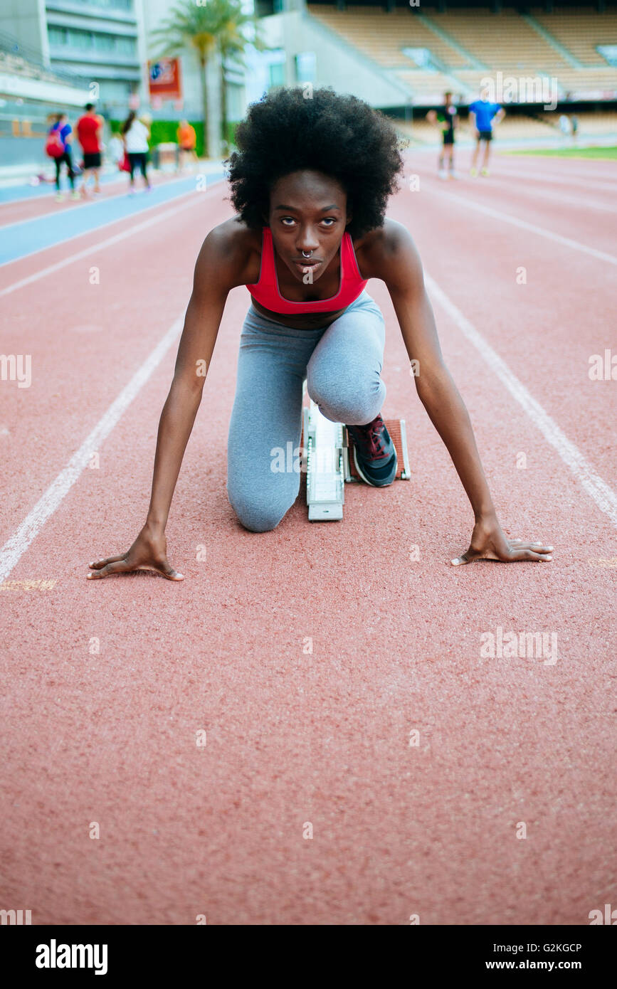 Young black athlete preparing for race in stadium Stock Photo - Alamy
