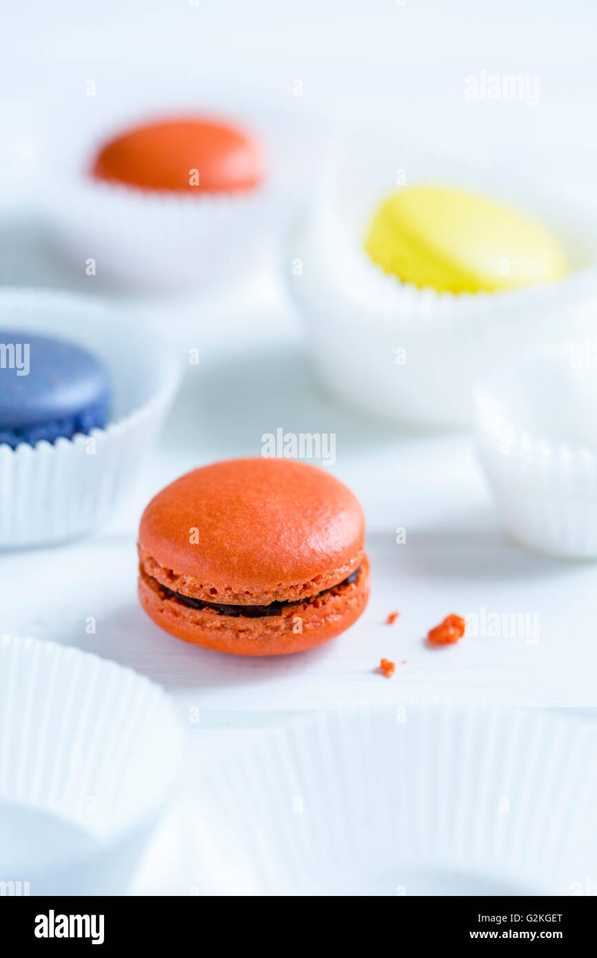 Colourful macarons and white paper cups Stock Photo - Alamy