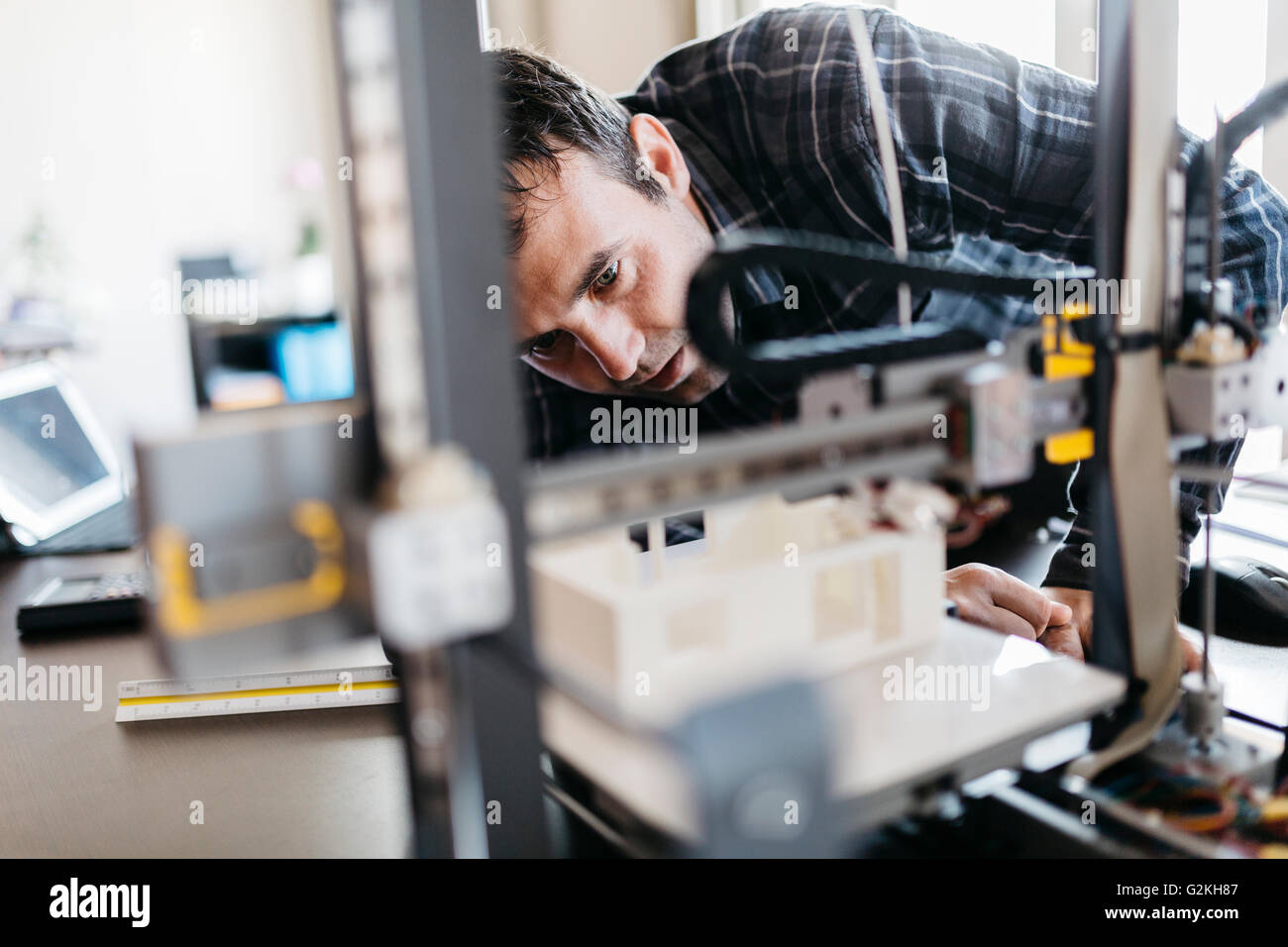 Worker controlling a model, 3D printer Stock Photo - Alamy