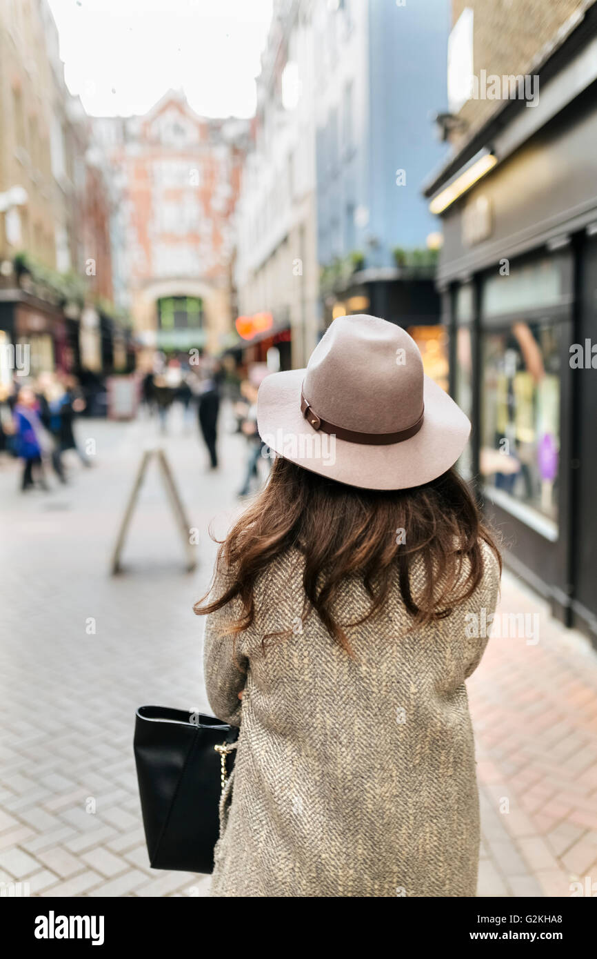 UK, London, back view of young woman on the street Stock Photo - Alamy