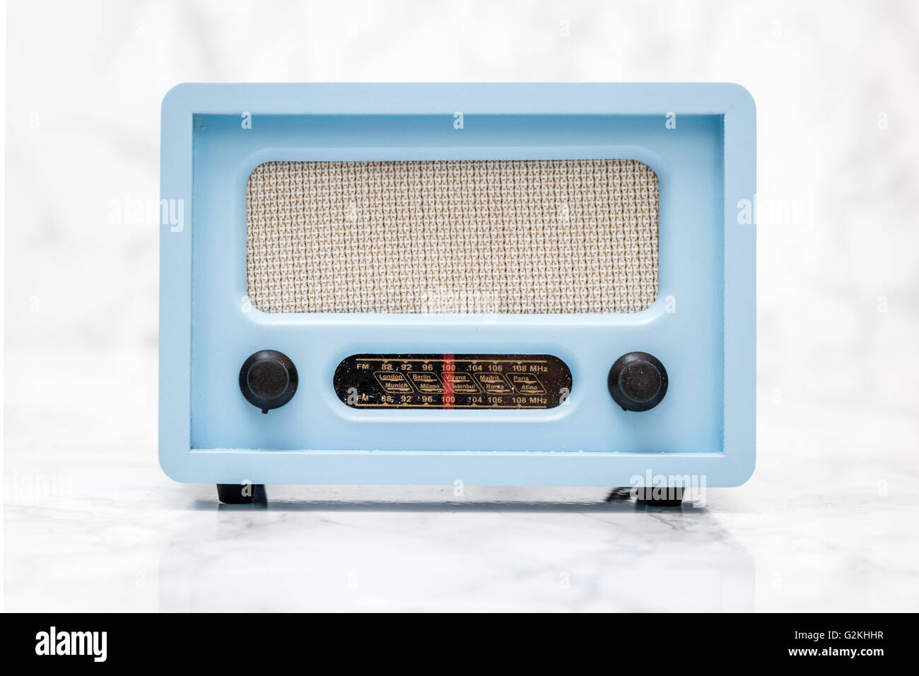 Blue radio with retro look on white marble background Stock Photo - Alamy