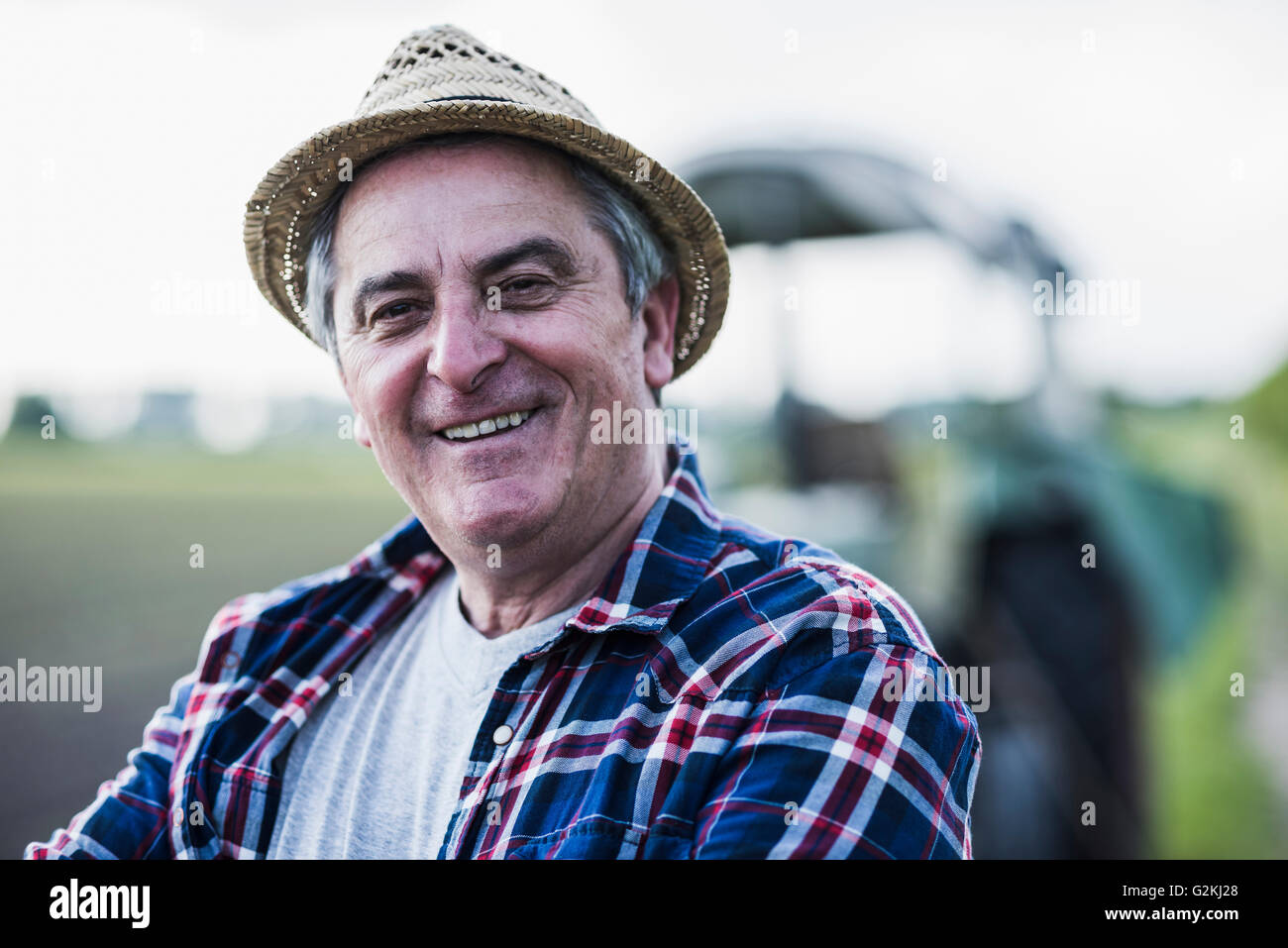 Portrait of smiling farmer Stock Photo - Alamy