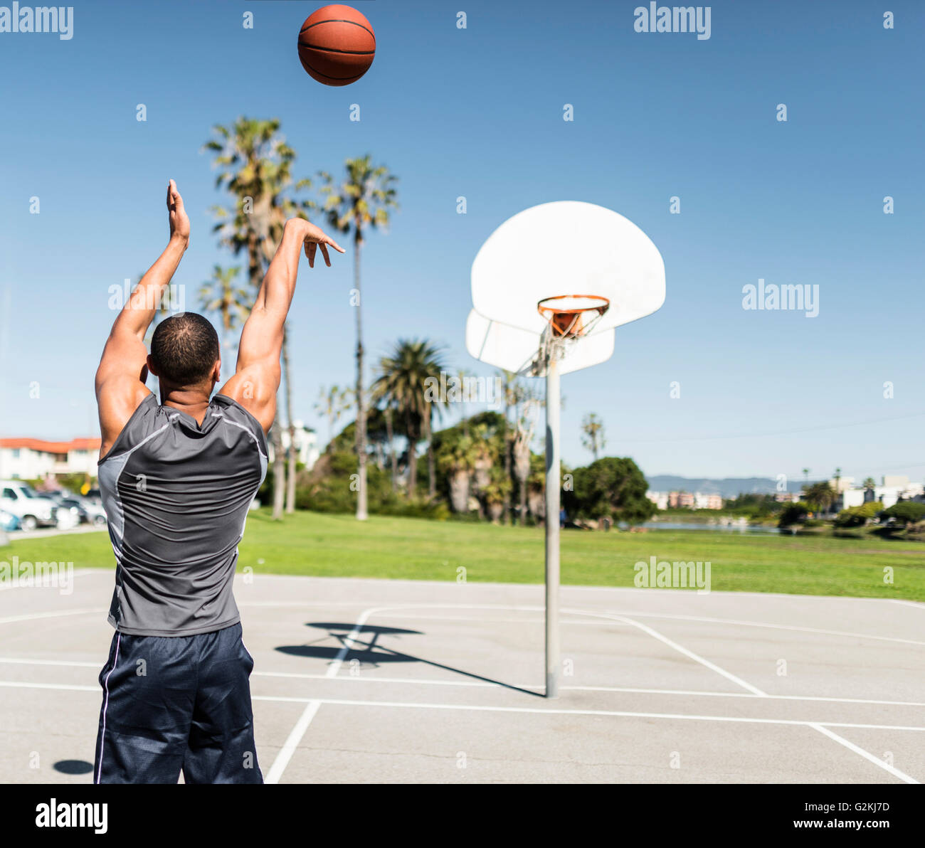 Young man practicing on outdoor court Stock Photo - Alamy