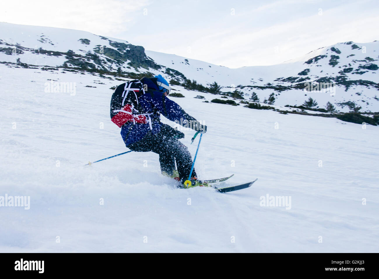 Man skiing in a snowy mountain landscape Stock Photo - Alamy