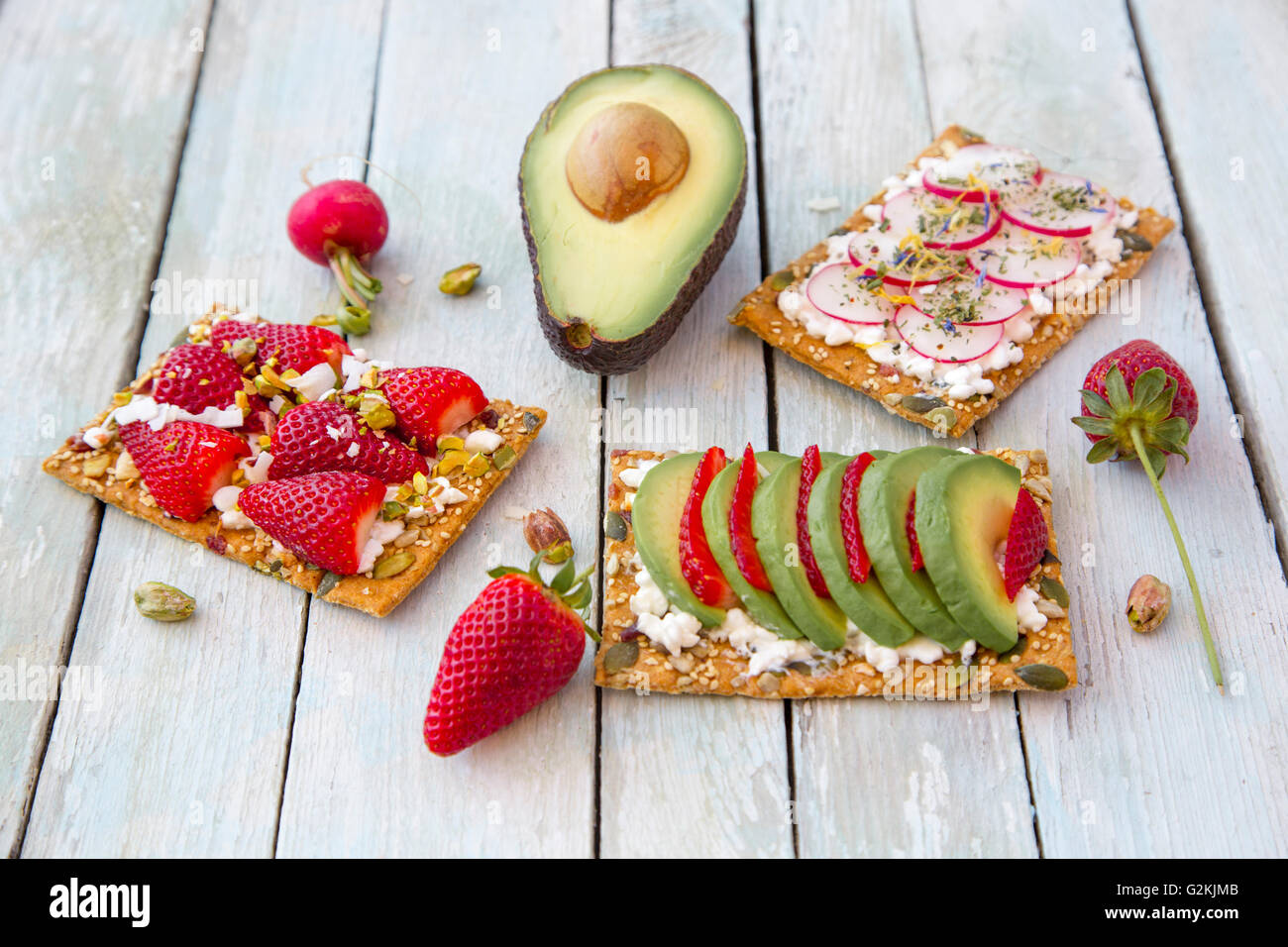 Three crispbreads with different toppings Stock Photo - Alamy