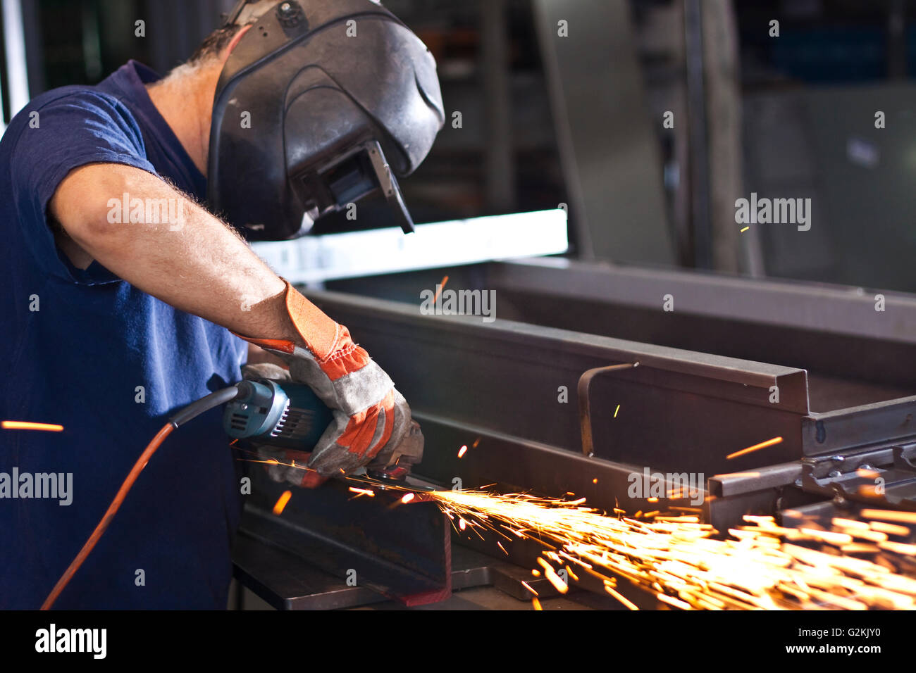 sparks during working with steel in the factory Stock Photo - Alamy