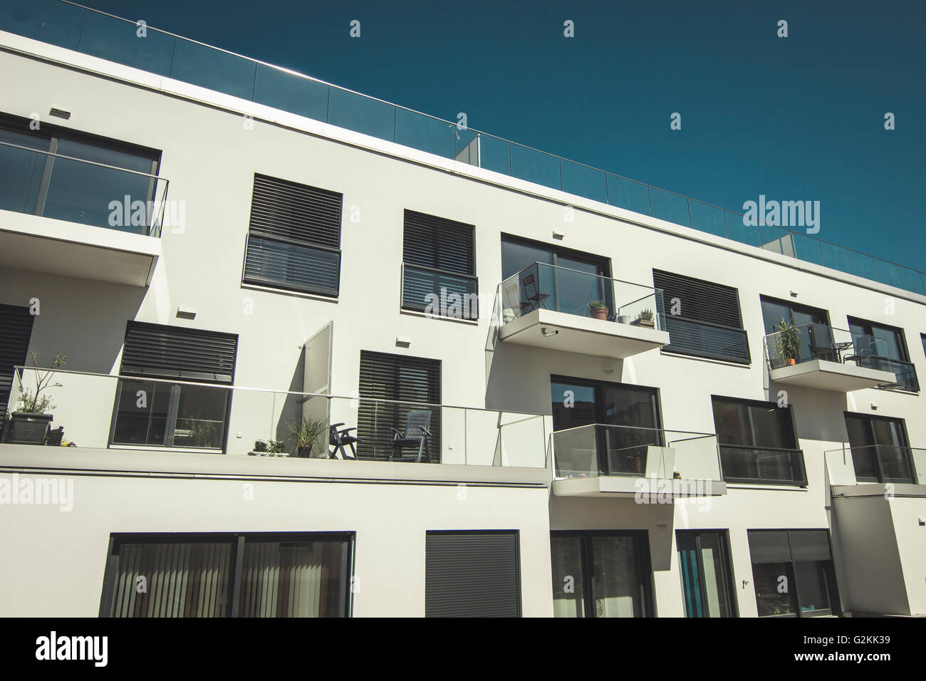 Facade of modern multi-family house with balconies Stock Photo - Alamy
