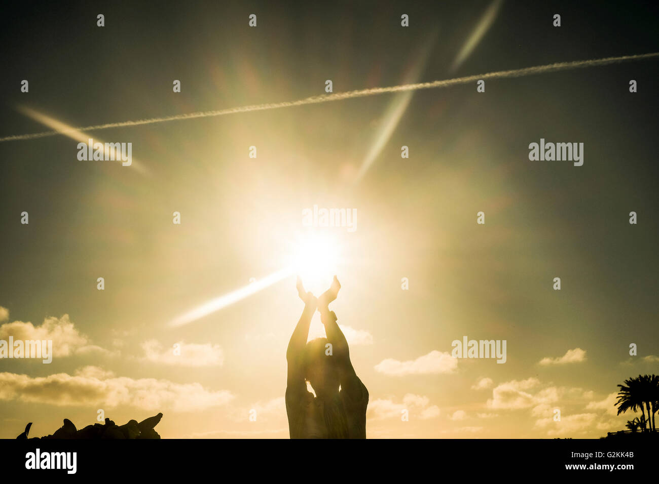 Boy playing with the sun Stock Photo - Alamy
