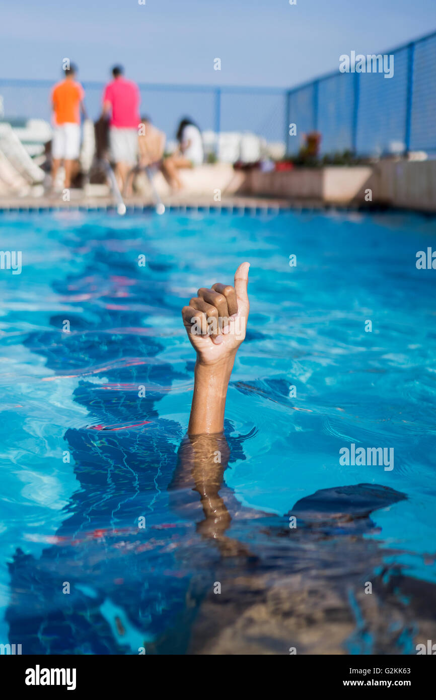 Hand of a boy inside swimming pool Stock Photo - Alamy