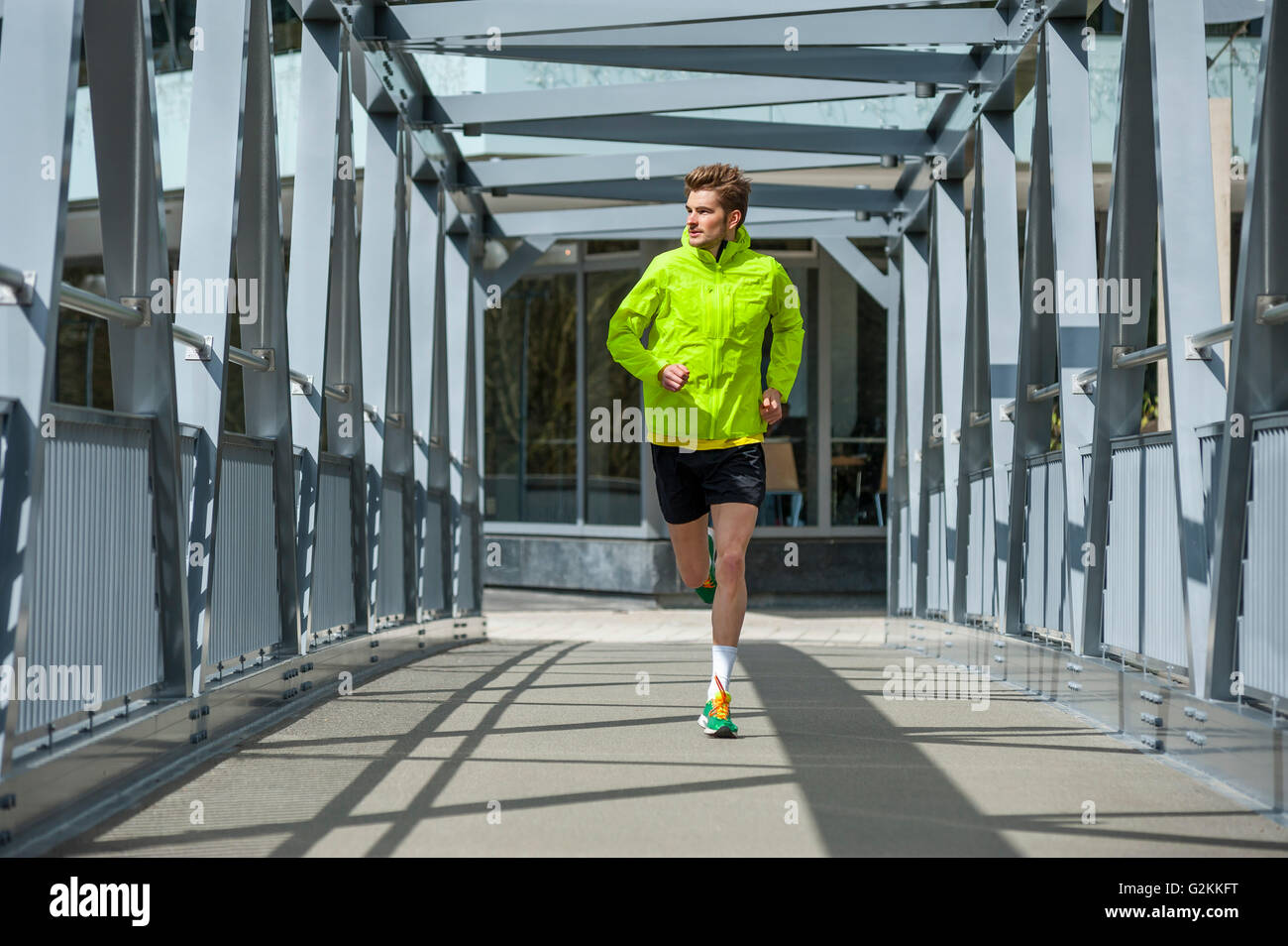 Young man jogging Stock Photo - Alamy
