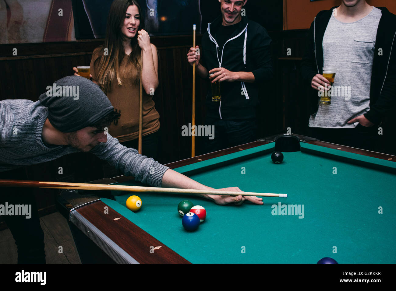 Man playing pool billard with friends in a bar Stock Photo - Alamy