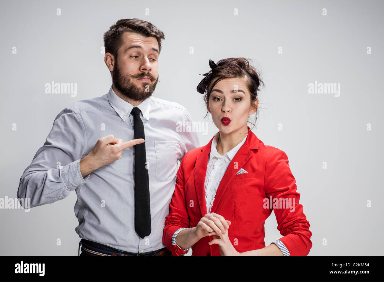 The business man and woman communicating on a gray background Stock ...