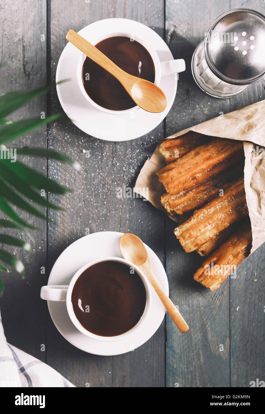 Churros with cups of hot chocolate Stock Photo - Alamy