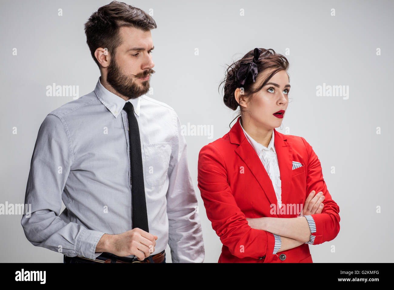 The business man and woman communicating on a gray background Stock ...