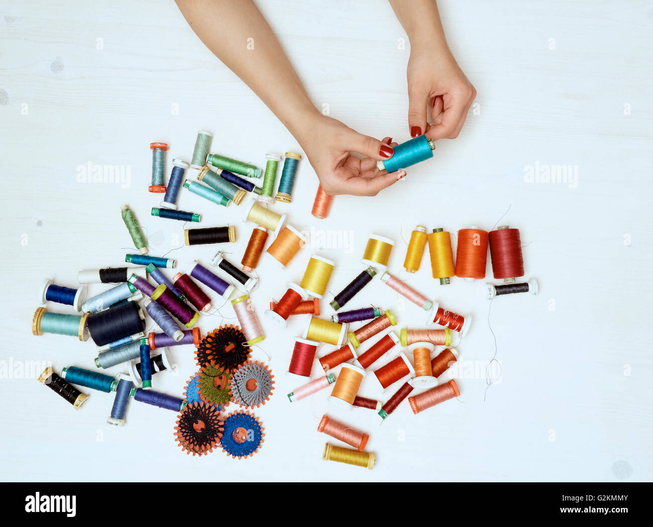 Hand sorting sewing utensils Stock Photo - Alamy