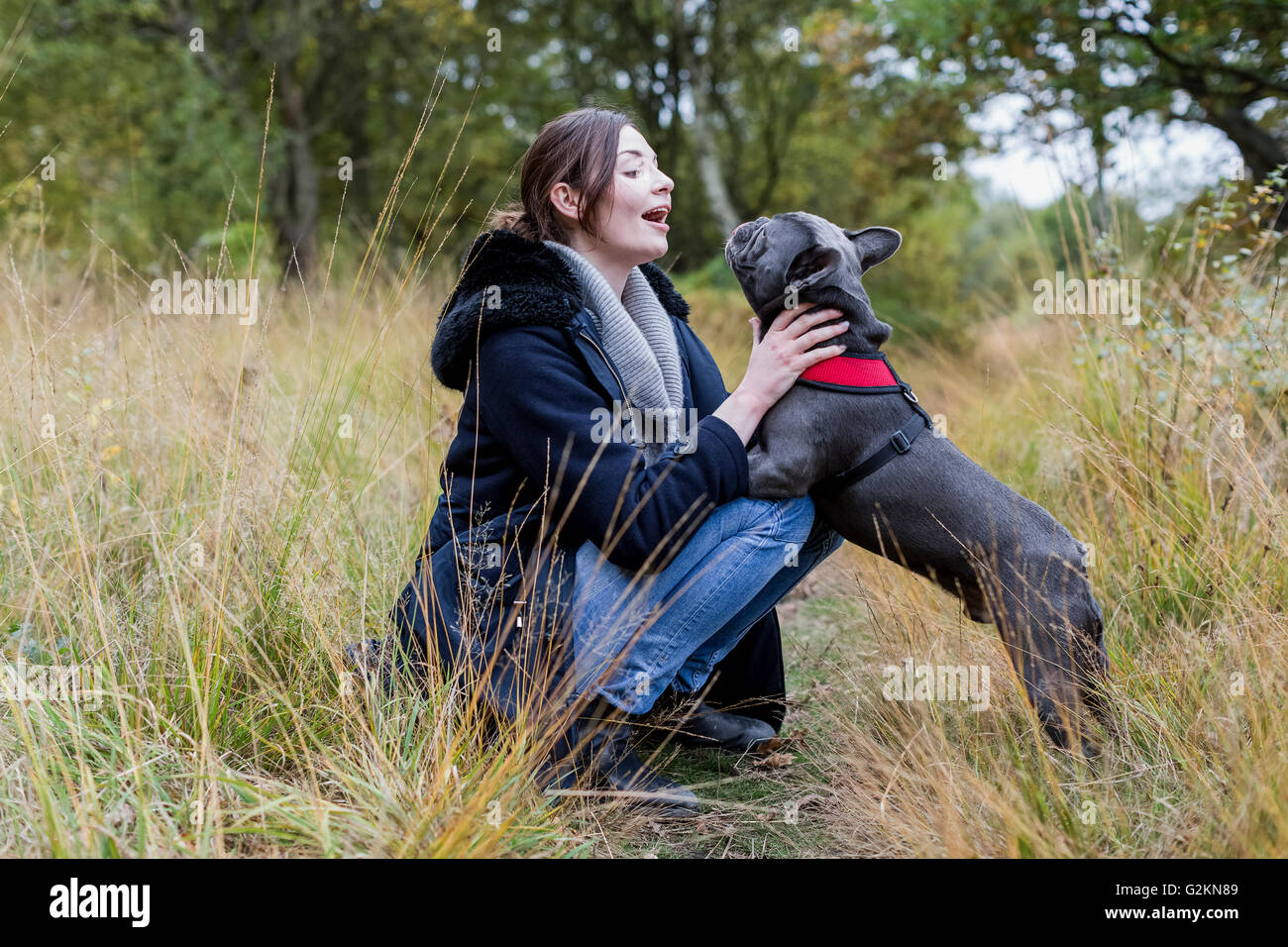 Woman with her dog in nature Stock Photo - Alamy