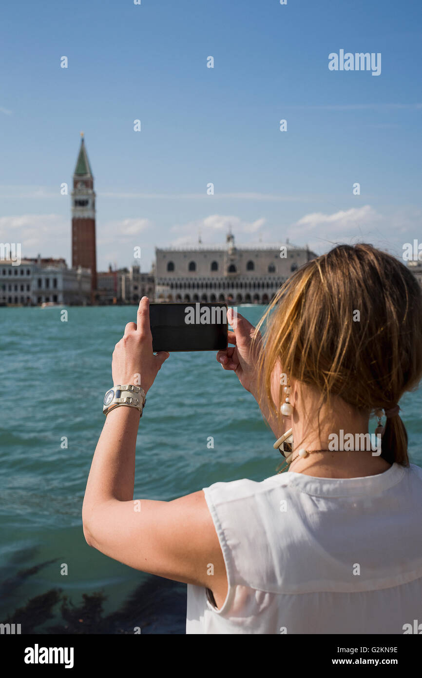 Italy, Venice, Tourist taking pictures with smart phone Stock Photo - Alamy
