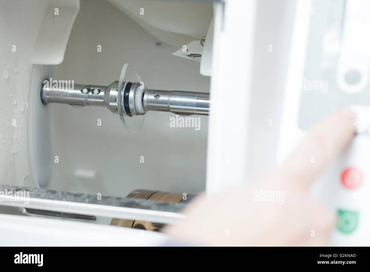 Machine manufacturing eyeglass lenses Stock Photo - Alamy