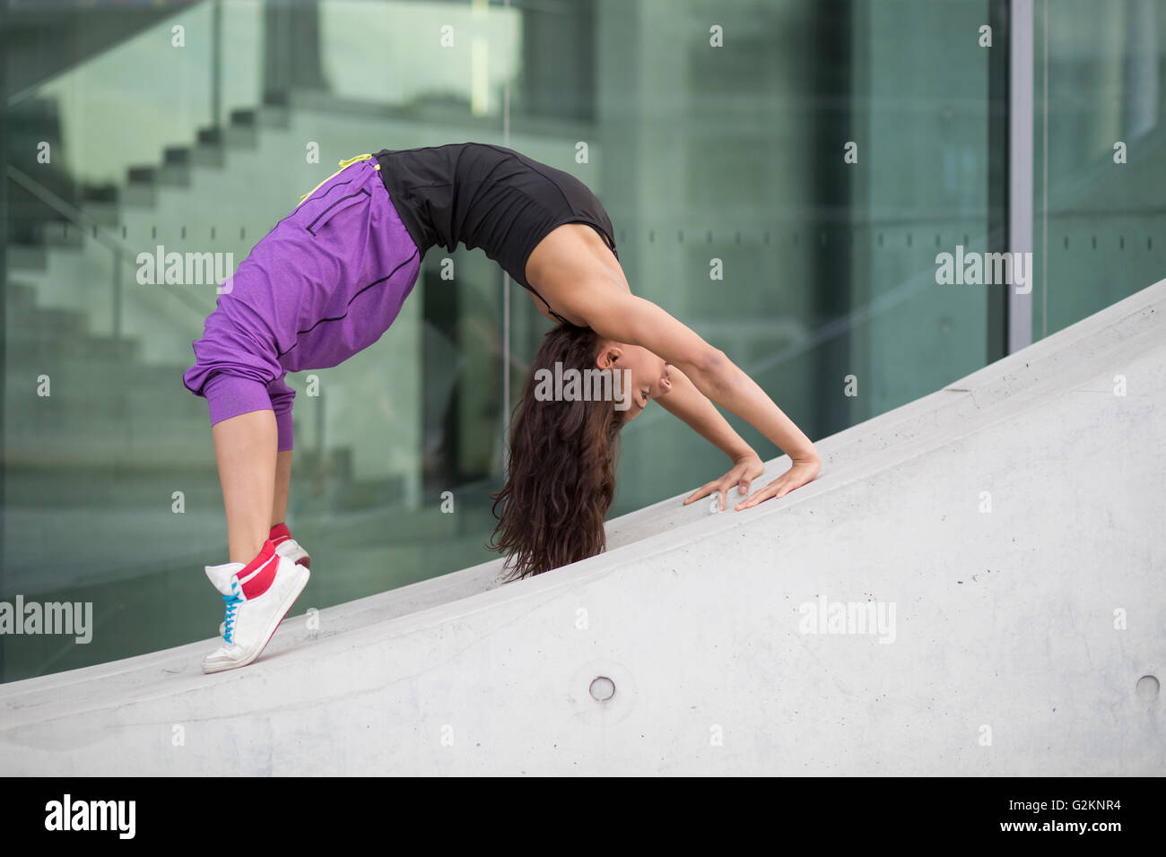 Young woman doing gymnastics outdoors Stock Photo - Alamy