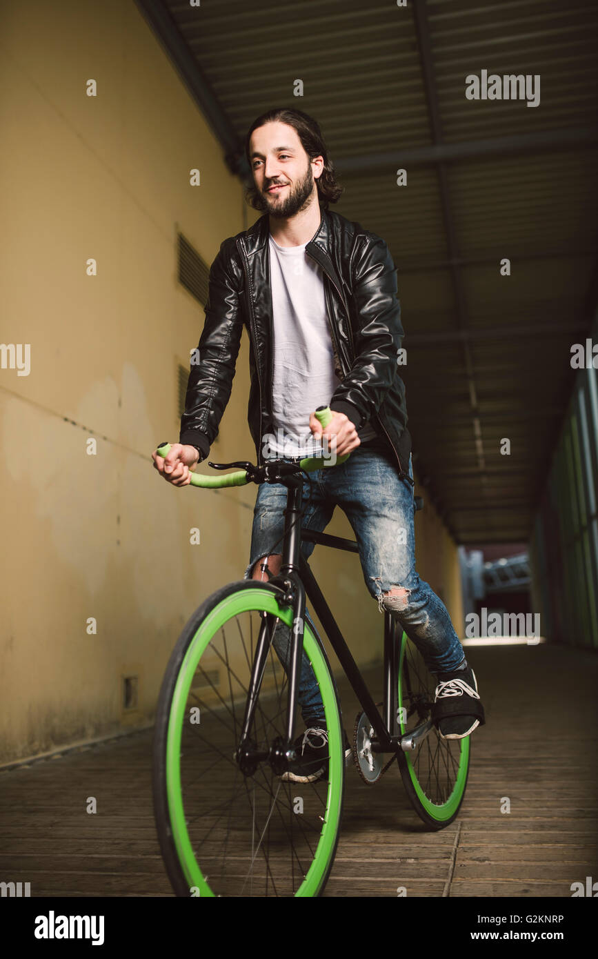 Young man riding fixie bike Stock Photo - Alamy