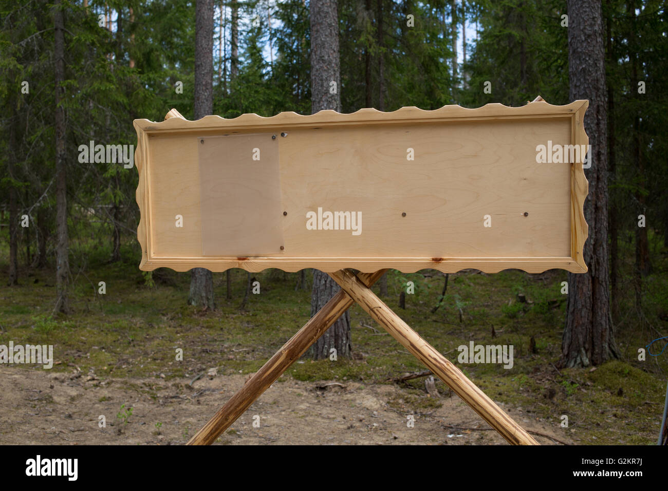Wooden frame for a sign against the forest Stock Photo - Alamy